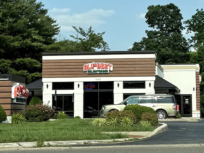 The neon sign beckons like a lighthouse for the hungry&mdash;All The Best Delicatessen's modern exterior promises delicious treasures within.