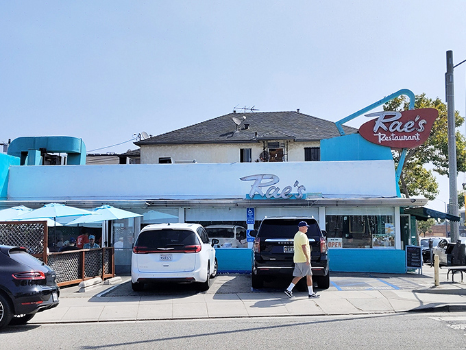That turquoise and white facade might look humble, but inside lies breakfast magic waiting to happen.