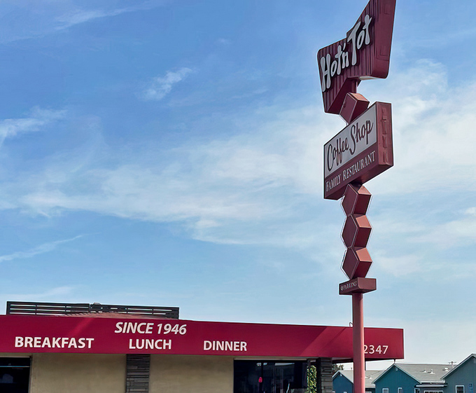 That iconic red awning is like a beacon of breakfast hope on Pacific Coast Highway. Classic diner architecture at its finest.