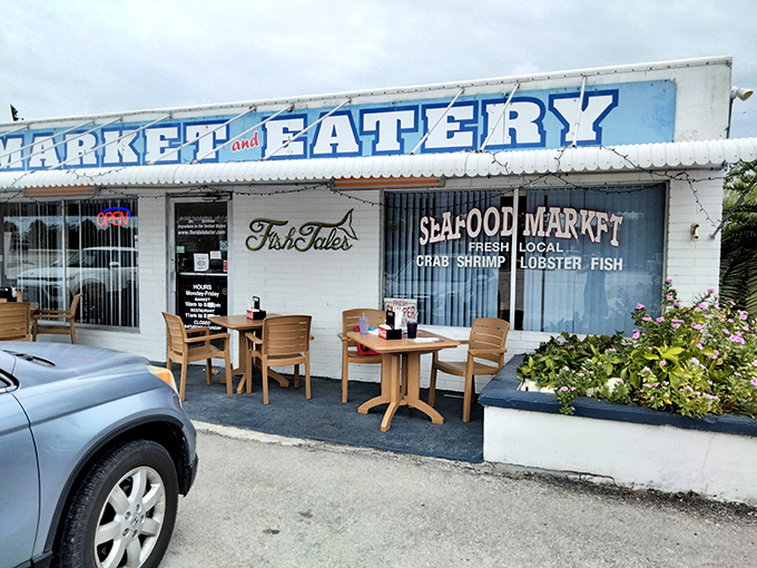 The bright blue exterior of Fish Tales stands out like a delicious mirage on Marathon's sun-drenched landscape, promising seafood treasures within.