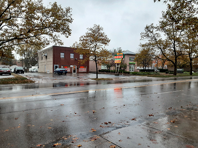 The unassuming brick exterior of Rubino's stands like a time capsule on East Main Street, its vintage neon sign a beacon for pizza pilgrims.