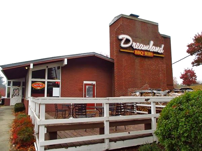The brick fortress of flavor stands proud with its white-railed porch, like a barbecue beacon calling hungry souls to meat salvation.