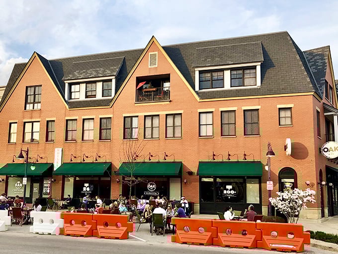 The welcoming brick facade of Oak at The Glen stands proudly in Glenview, where those orange barriers aren't keeping people out&mdash;they're creating the perfect outdoor dining sanctuary.