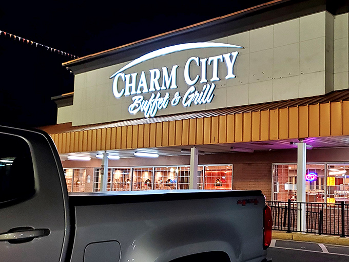 The gleaming sign against a blue Maryland sky promises what every hungry traveler seeks: unlimited culinary possibilities with a side of Old Bay seasoning.
