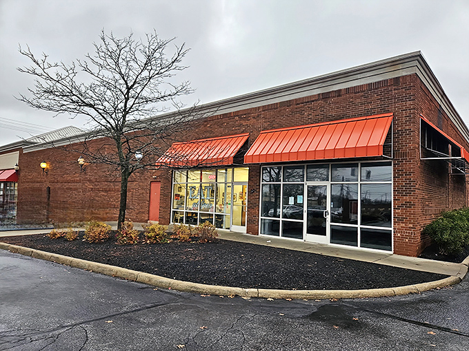 The unassuming red awning of Eat at Joe's beckons like a breakfast lighthouse on South Green Road, promising comfort and satisfaction to all who enter.