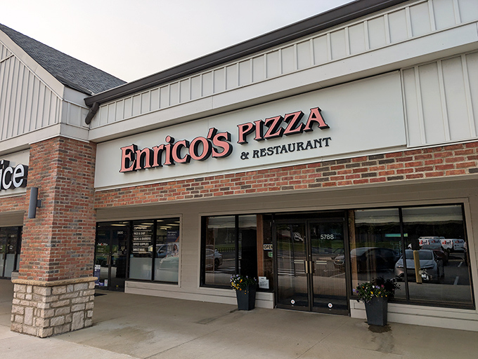 The unassuming storefront that houses pizza greatness. Like finding a Picasso at a yard sale, Enrico's modest exterior belies the culinary treasures within.