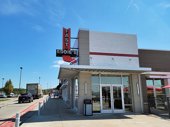 The bold red signage of Fast Eddie's stands out against the modern brick exterior, beckoning hungry travelers like a culinary lighthouse in Parma.