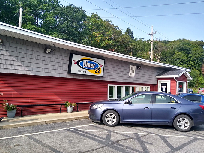 Red siding and honest signage announce a place where breakfast dreams come true daily.
