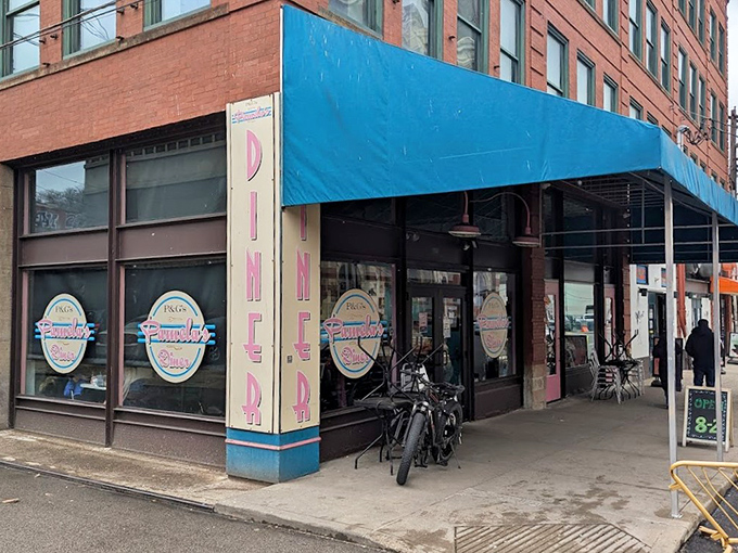 That turquoise awning isn't just a color choice &ndash; it's a beacon calling hungry souls to breakfast nirvana.