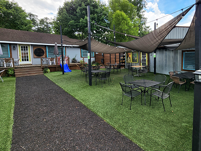 A backyard paradise awaits! Higher Ground's outdoor seating area combines casual charm with those canvas sails that make you feel like you're dining on a fancy yacht.