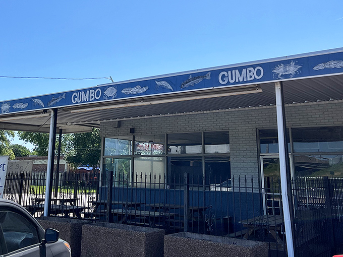 The blue awning with "GUMBO" repeated like a delicious mantra tells you everything you need to know about this Dallas treasure.