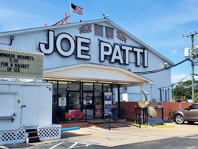 The white building stands like a culinary lighthouse on Pensacola's waterfront, beckoning seafood lovers with its no-nonsense promise of oceanic treasures within.