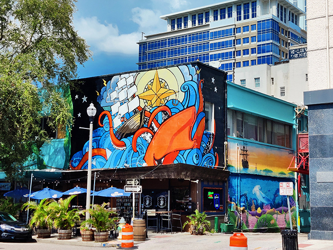 The vibrant nautical mural adorning The Galley's exterior isn't just art—it's a colorful promise of the seafood treasures waiting inside.