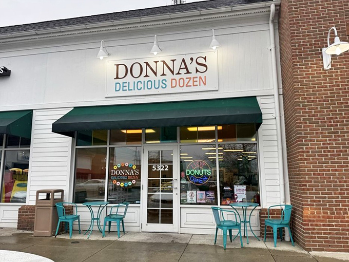The white storefront with its cheerful teal accents beckons like a sugar-coated siren call to donut lovers across Columbus.