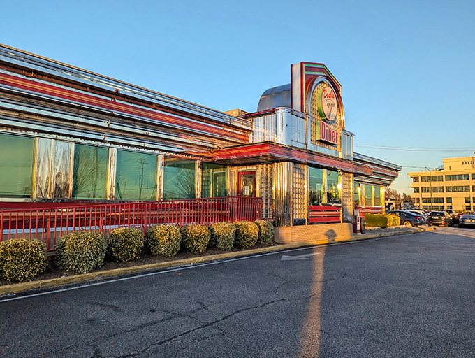 Neon dreams come true at Double T Diner, where the glowing sign beckons hungry travelers like a lighthouse for the famished. The classic Americana exterior promises comfort inside.