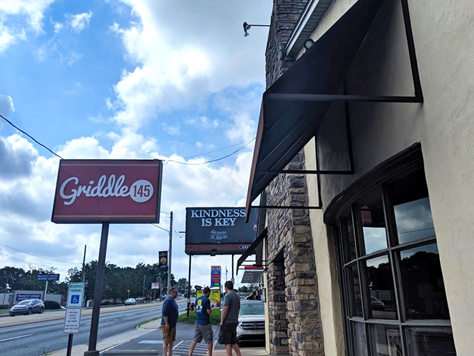 The red "Griddle 145" sign welcomes hungry breakfast seekers, while the "Kindness is Key" message hints at the warmth waiting inside.