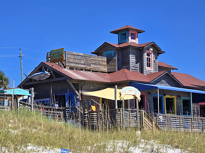 Pompano Joe's weathered wooden exterior isn't trying to impress anyone&mdash;yet somehow manages to charm everyone with its colorful Caribbean-inspired architecture perched right on the dunes. 