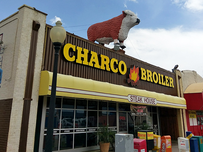 That iconic yellow awning and bold signage isn't just a restaurant front—it's a beacon of hope for the steak-deprived souls of Dallas.