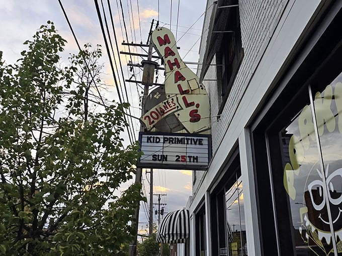 The white-brick facade of Mahall's stands like a time capsule on Madison Avenue, complete with vintage signage and that classic striped awning that screams "good times inside."