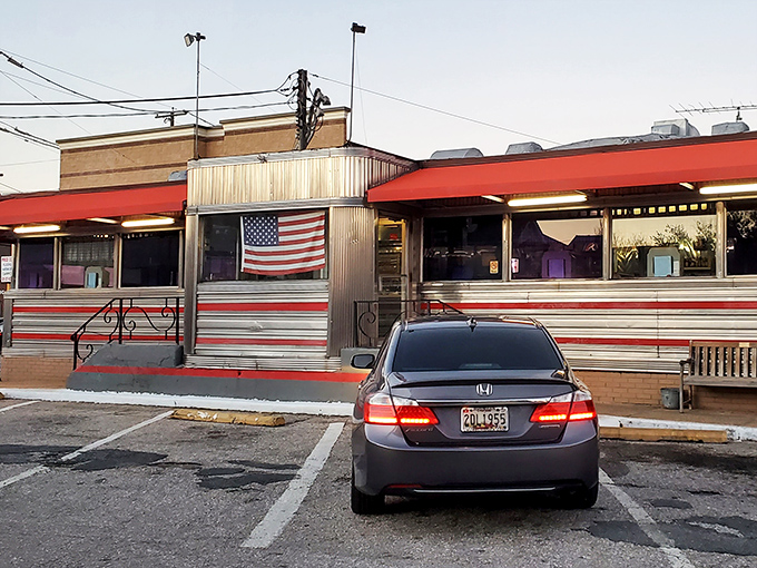 The classic silver-and-red exterior of Tastee Diner stands like a time machine on Route 1, complete with American flag proudly declaring its diner citizenship.