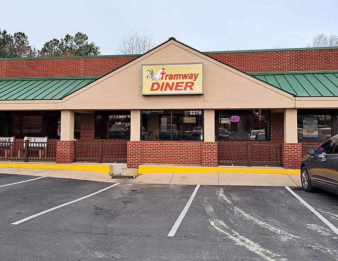 The unassuming exterior of Tramway Diner hides breakfast treasures within. That packed parking lot? Not a coincidence, folks.