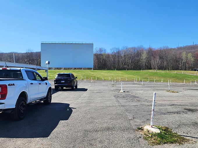 The magic hour at Circle Drive-In, when cars gather like faithful pilgrims and the screen awaits its nightly transformation into a portal to other worlds.