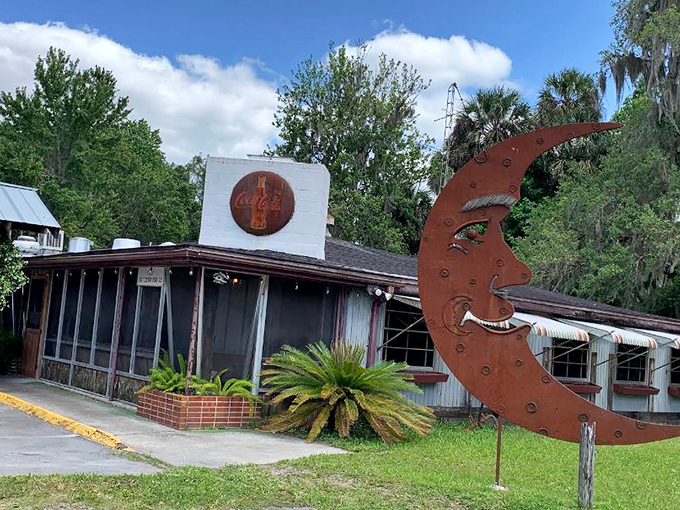 The unassuming entrance to The Yearling Restaurant feels like stepping into a Florida time capsule, where Spanish moss and literary history await hungry travelers.