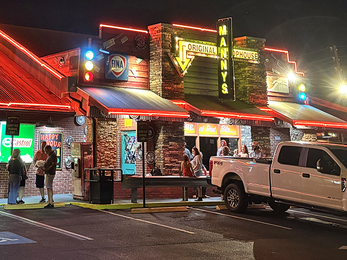 The ultimate roadside revelation: Manny's exterior blends vintage gas station charm with steakhouse promise, like finding treasure at a rest stop.