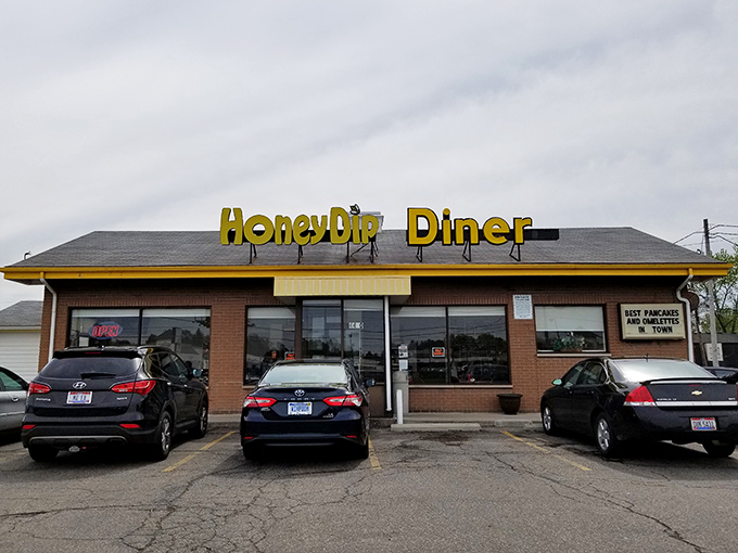 The yellow sign beckons like a lighthouse for the breakfast-starved. Honey Dip's modest exterior hides culinary treasures that locals have cherished for generations.