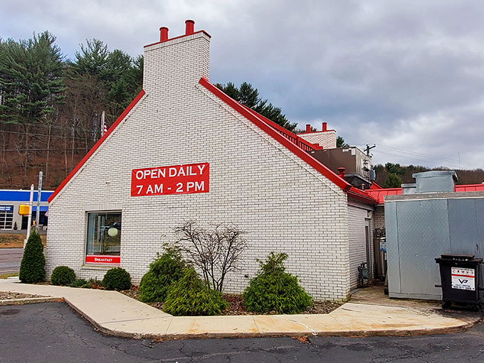 That iconic red roof signals you've arrived at breakfast paradise. The white brick building with its classic "OPEN DAILY" sign promises comfort food magic awaits inside.