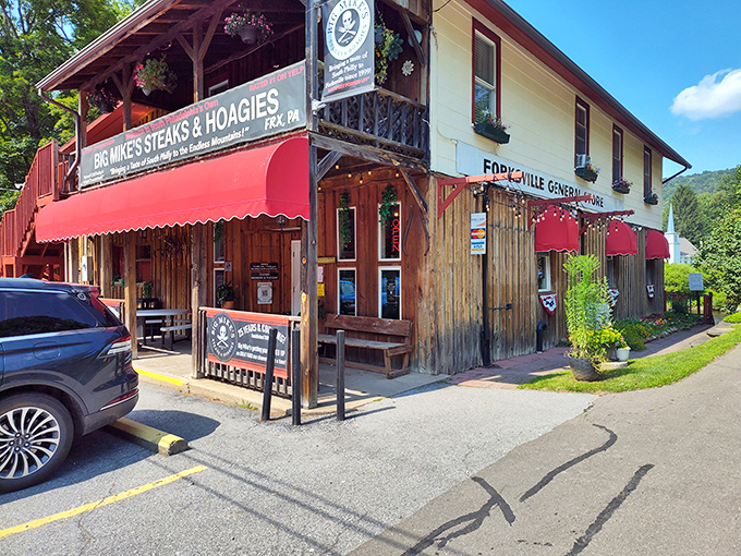Rustic charm meets culinary legend at Big Mike's, where that red awning and wooden exterior signal you've found Pennsylvania's hidden cheesesteak paradise.