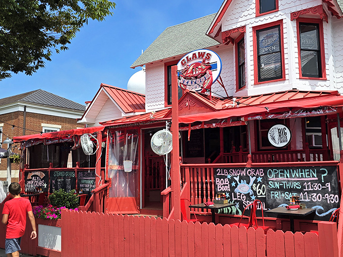 The Victorian charm of Claws Seafood House beckons seafood lovers with its distinctive white exterior and vibrant red trim. A coastal treasure hiding in plain sight.