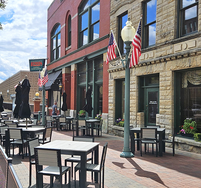 The historic brick fa&ccedil;ade of Bender's Tavern stands proudly in downtown Canton, where American flags flutter like culinary battle standards over the inviting outdoor seating area.