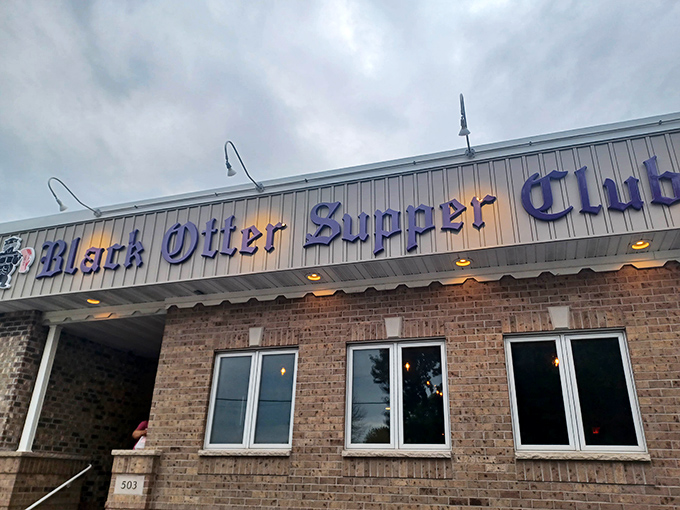 The iconic blue lettering against brick promises what every Wisconsin road trip deserves—a destination worth the journey.