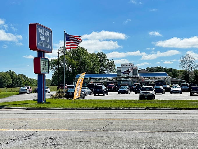 The patriotic facade of Four Star Family Restaurant gleams like a beacon for hungry travelers, promising all-American comfort in the heart of Mt. Zion.