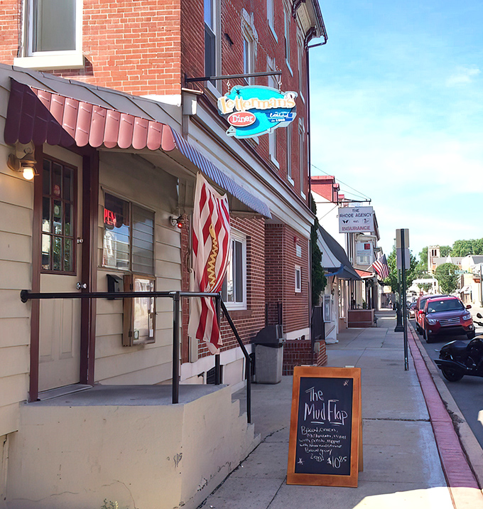 The classic brick exterior of Letterman's Diner stands proudly on Kutztown's main street, its vintage sign and American flag promising authentic comfort within.
