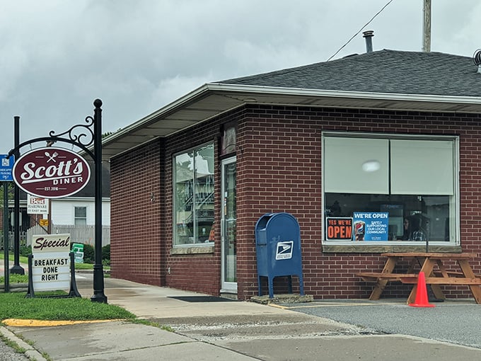 The brick exterior of Scott's Diner stands like a beacon of comfort food hope in New Concord, promising breakfast done right and memories in the making.