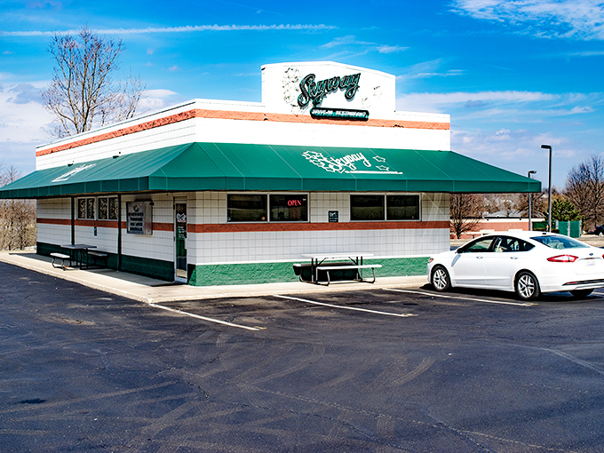 The classic mid-century facade of Skyway Drive-In stands proudly against an Ohio blue sky, a time capsule of American dining nostalgia.