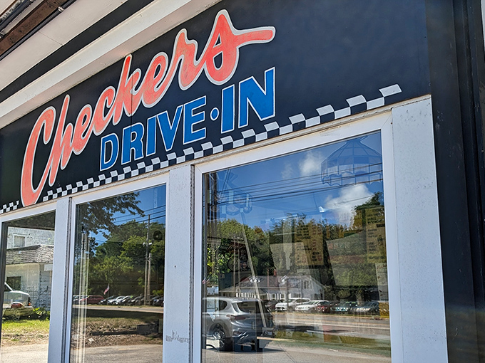 The iconic black exterior with red and blue lettering announces you've arrived at burger paradise. No fancy frills, just the promise of greatness ahead. 