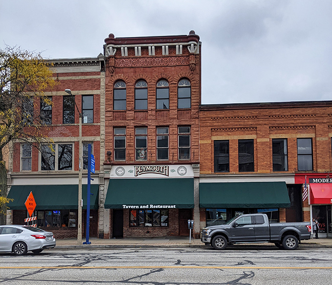 The brick fa&ccedil;ade of Plymouth Tavern stands proudly on Erie's State Street, a three-story testament to timeless hospitality that beckons hungry travelers inside.