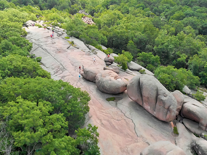 Nature's playground at its finest! These billion-year-old pink granite boulders create a surreal landscape that begs to be explored and climbed.