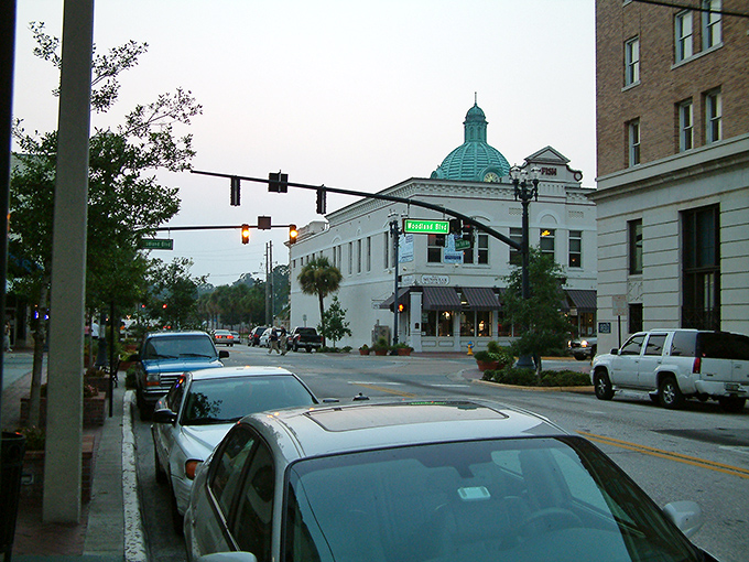 Downtown DeLand at dusk, where historic brick buildings and vintage lampposts create the perfect backdrop for an evening stroll. Small-town America at its finest.
