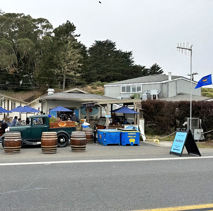 The unassuming exterior of seafood paradise &ndash; where wooden barrels, blue umbrellas, and a vintage truck create the perfect coastal vibe for chowder pilgrims.