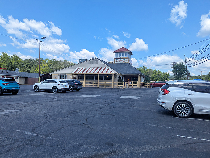 The unassuming exterior of Smuggler's Cove belies the seafood treasures within. That lighthouse-inspired tower isn't just for show—it's guiding hungry travelers home.