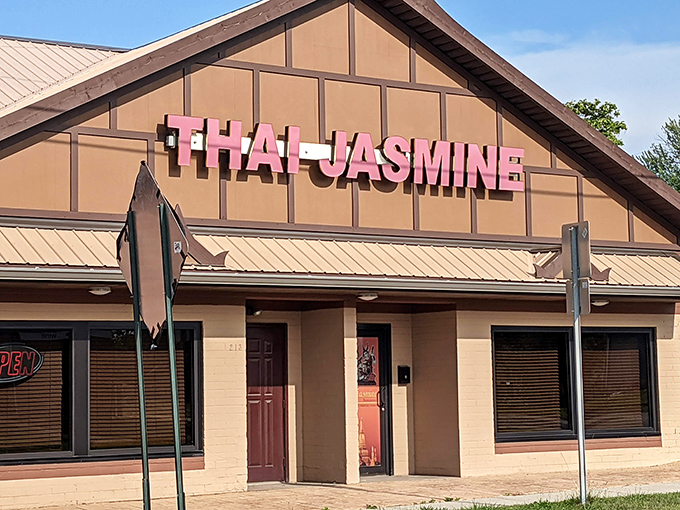 The distinctive peaked roof and bold red signage of Thai Jasmine stands as Lima's portal to authentic Thai flavors, beckoning hungry travelers from miles around.