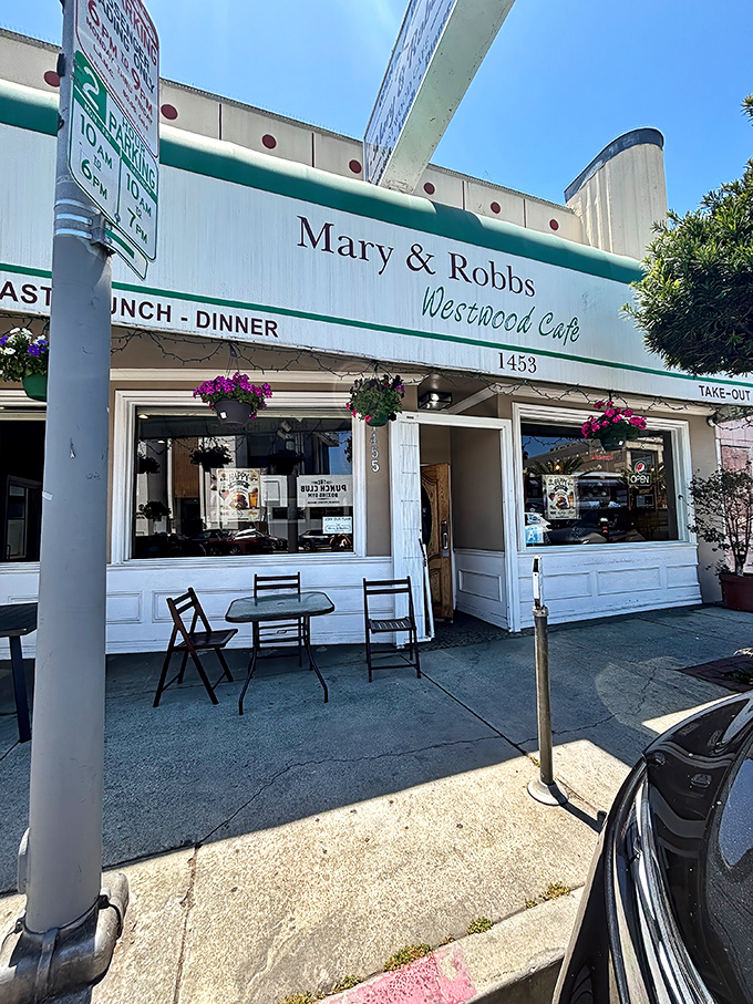The classic green-trimmed exterior of Mary and Robb's Westwood Cafe stands as a beacon of comfort food in a sea of trendy LA eateries.