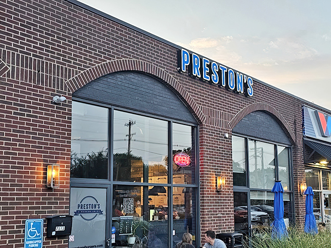 Preston's brick exterior says "no frills" but the glowing blue sign promises something special waiting inside for burger enthusiasts.