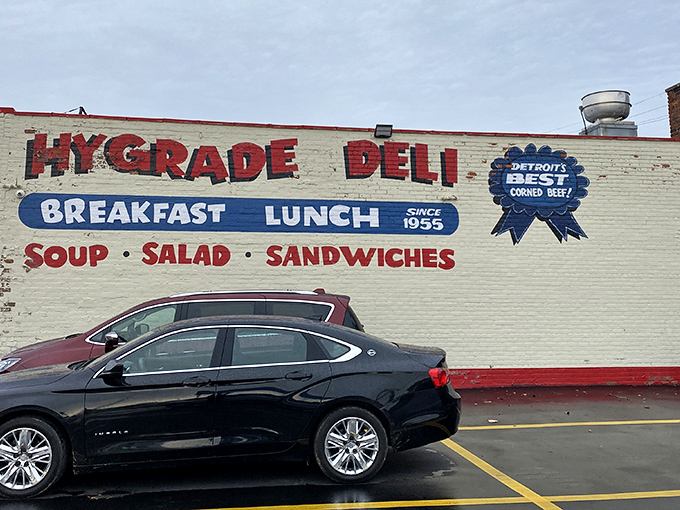 The iconic white brick exterior of Hygrade Deli stands as a beacon of sandwich salvation in Detroit, promising "Detroit's Best Corned Beef" since 1955.