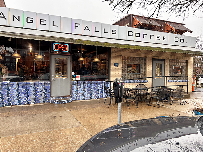 The colorful mosaic-like sign of Angel Falls Coffee beckons like a caffeinated rainbow against Akron's skyline. Coffee paradise found!