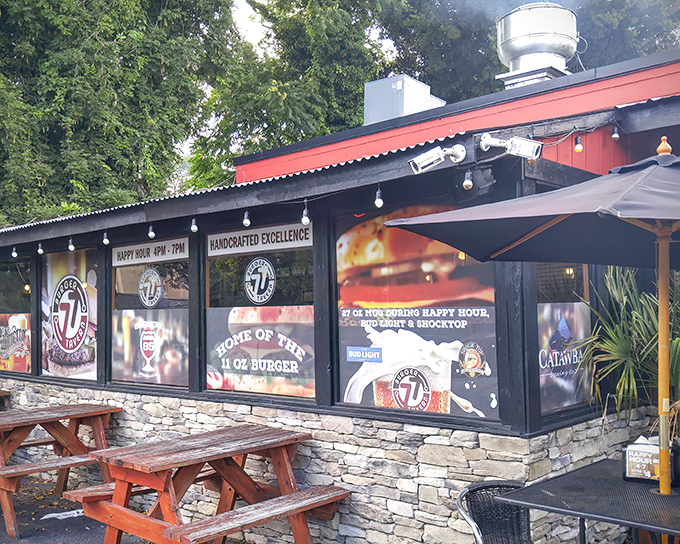The stone facade and wooden picnic tables might look unassuming, but this burger sanctuary proudly announces its mission right on the window: "Home of the 11 oz Burger."